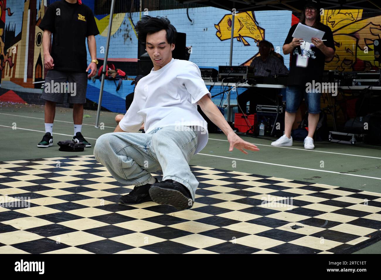A male hip hop dancer stepping into a slide, Breakdancing performances, competition and battles ...