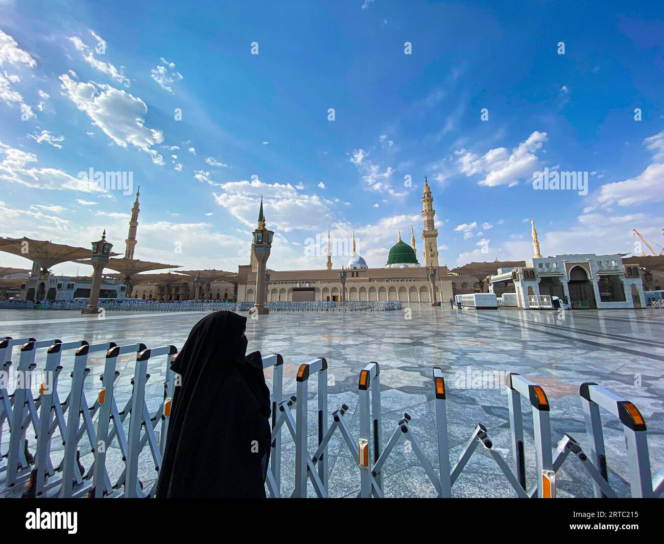 Medina, Saudi Arabia - August 22, 2023: Pilgrims standing in front of ...