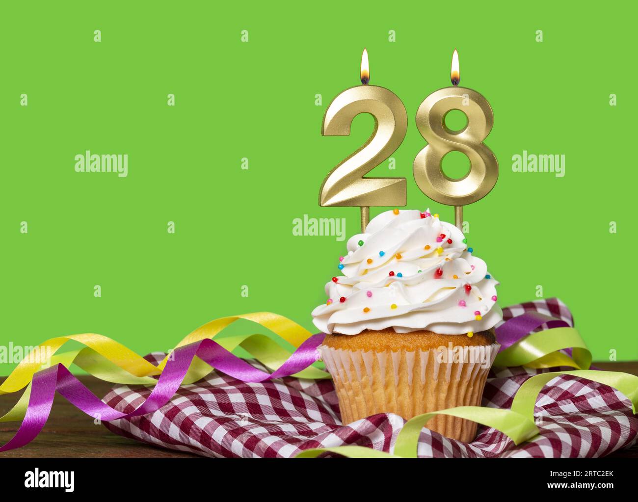 Birthday Cake With Candle Number 28 - On Green Background Stock Photo ...