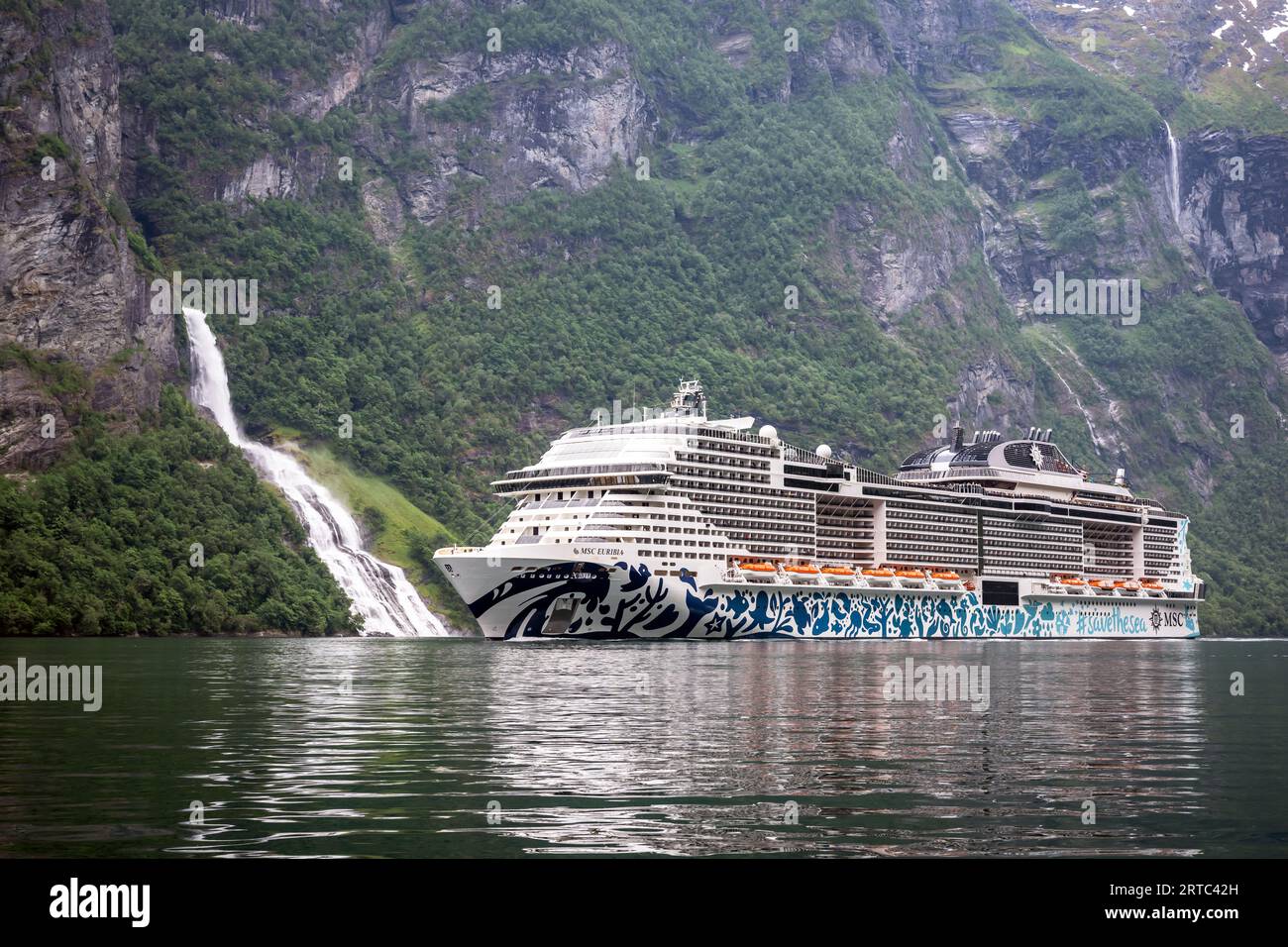 Cruise ship MSC Euriba under the waterfall in Geiranger Fjord, name ...