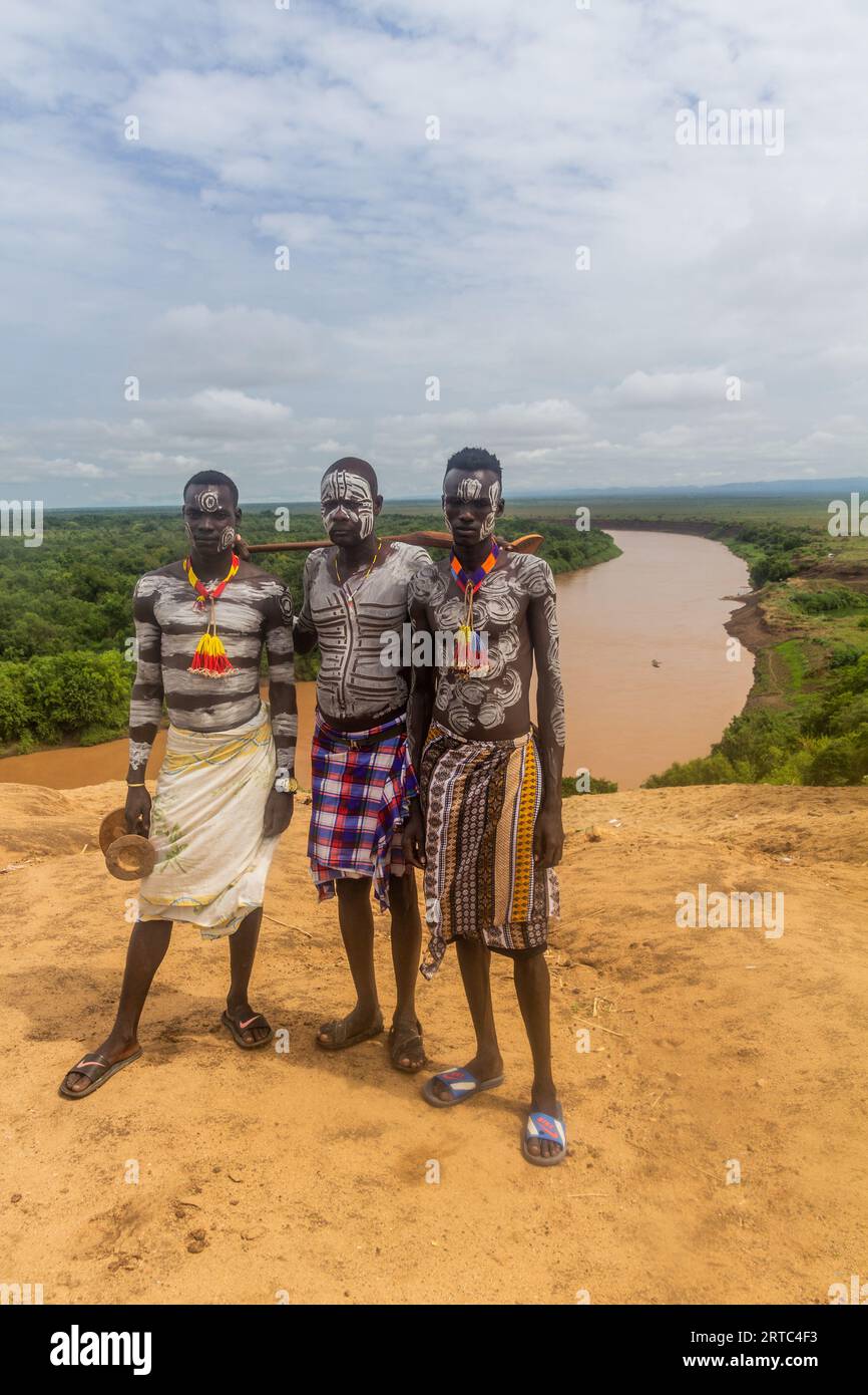 KORCHO, ETHIOPIA - FEBRUARY 4, 2020: Members of Karo tribe above Omo ...