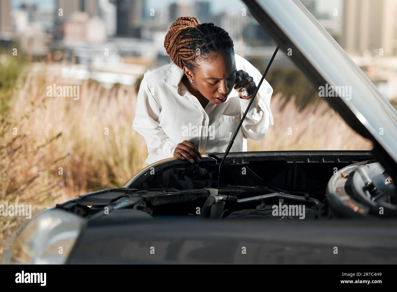 Phone call, stress and black woman fixing car in the road with ...