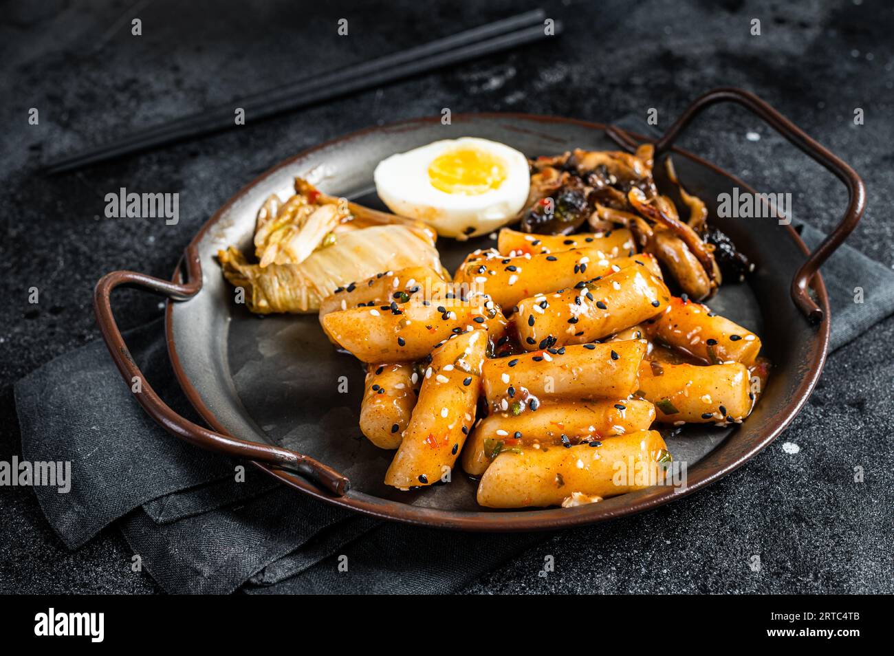 Tteokbokki, Topokki stick rice cake in Hot and spicy sauce with egg and ...