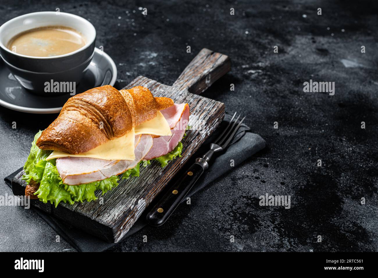 Croissant Club Sandwich with Ham and Cheese, cup of coffe. Black ...