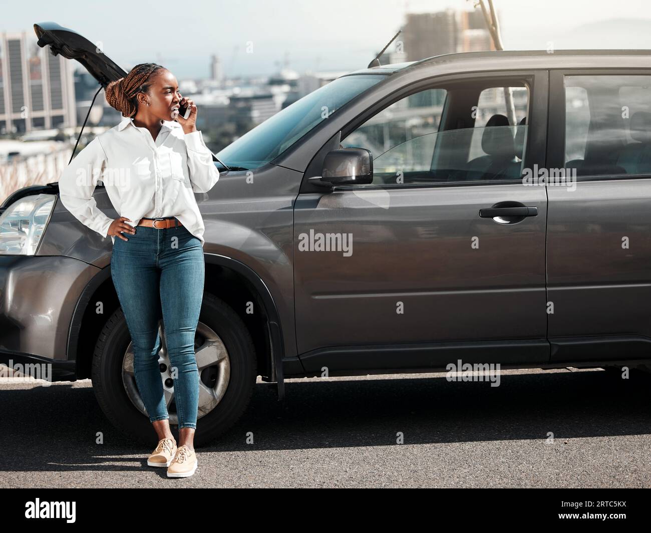 Phone call, stuck car and woman in the road with stress for engine ...
