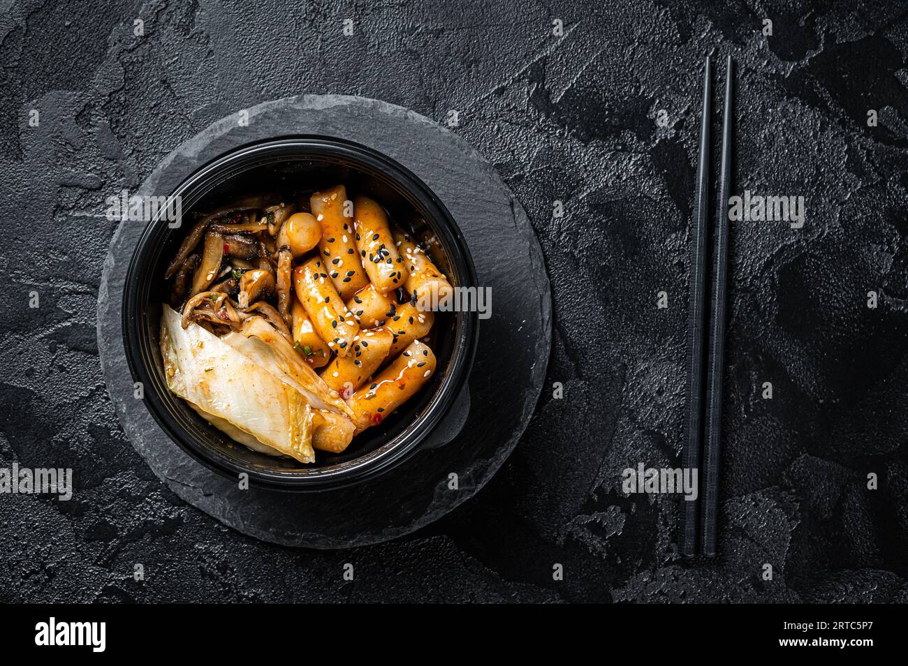 Korean street food Tteokbokki, Topokki fried rice cake stick in spicy ...