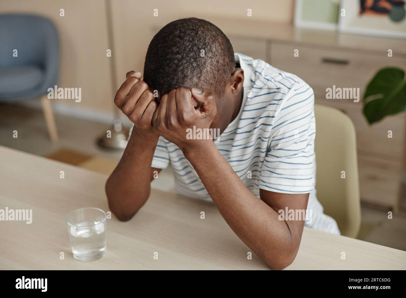Portrait of crying Black man suffering from mental health issues, copy ...