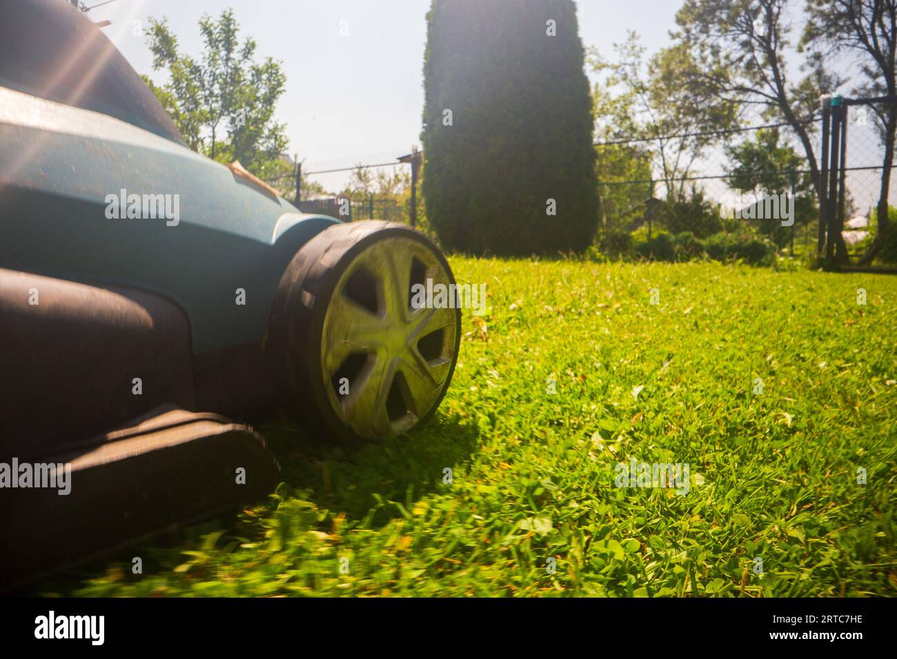 Lawn mover on green grass in modern garden or backyard. Machine for ...