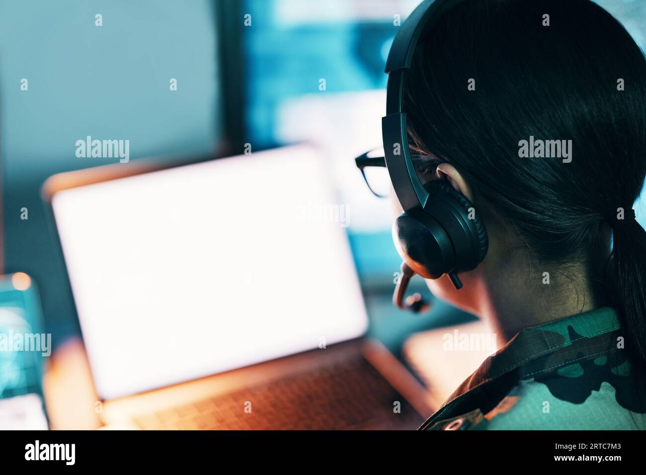 Military control room, computer screen and woman with mockup, headset ...