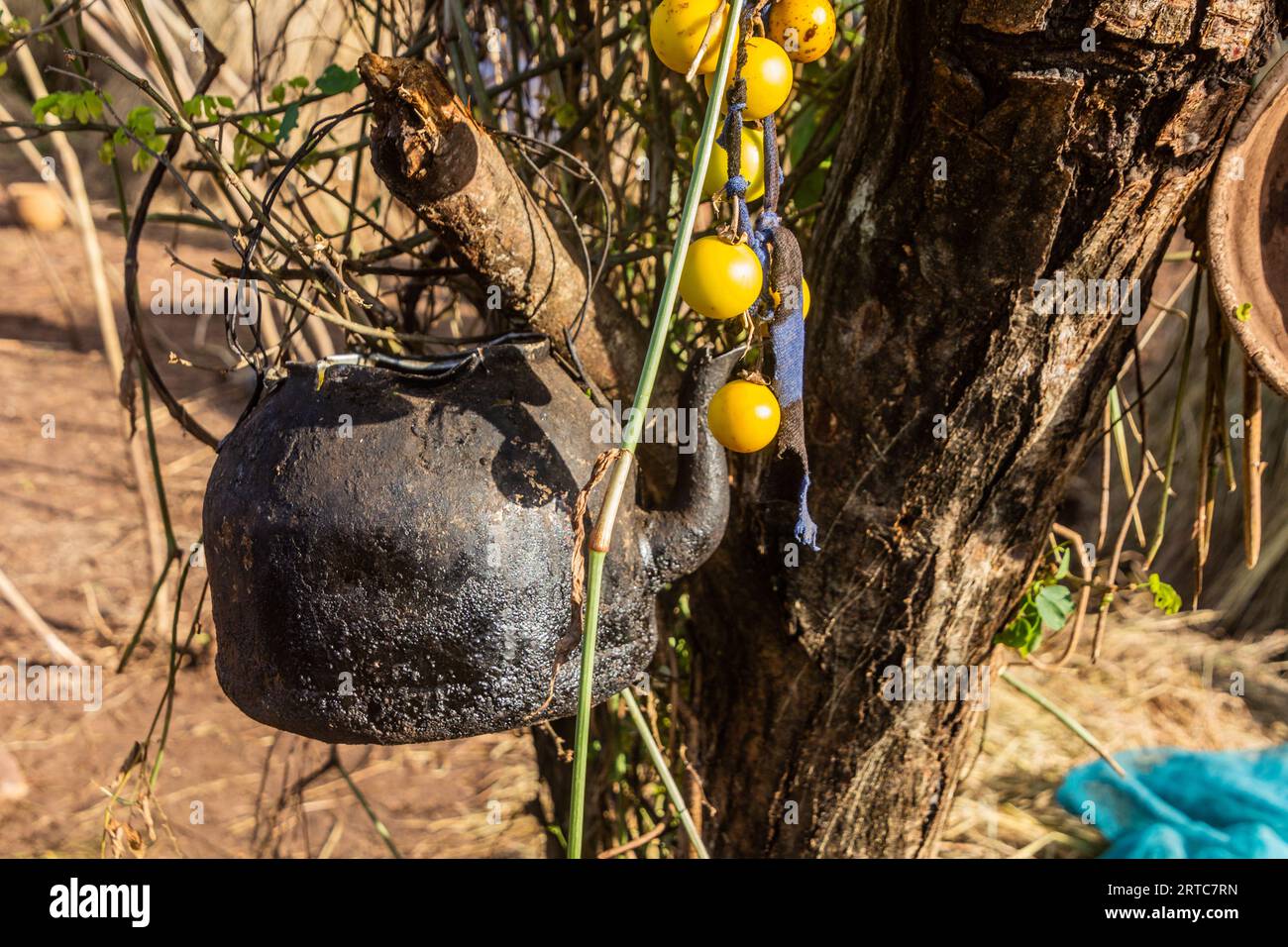 Kettle on a tree in Mursi tribe village, Ethiopia Stock Photo - Alamy