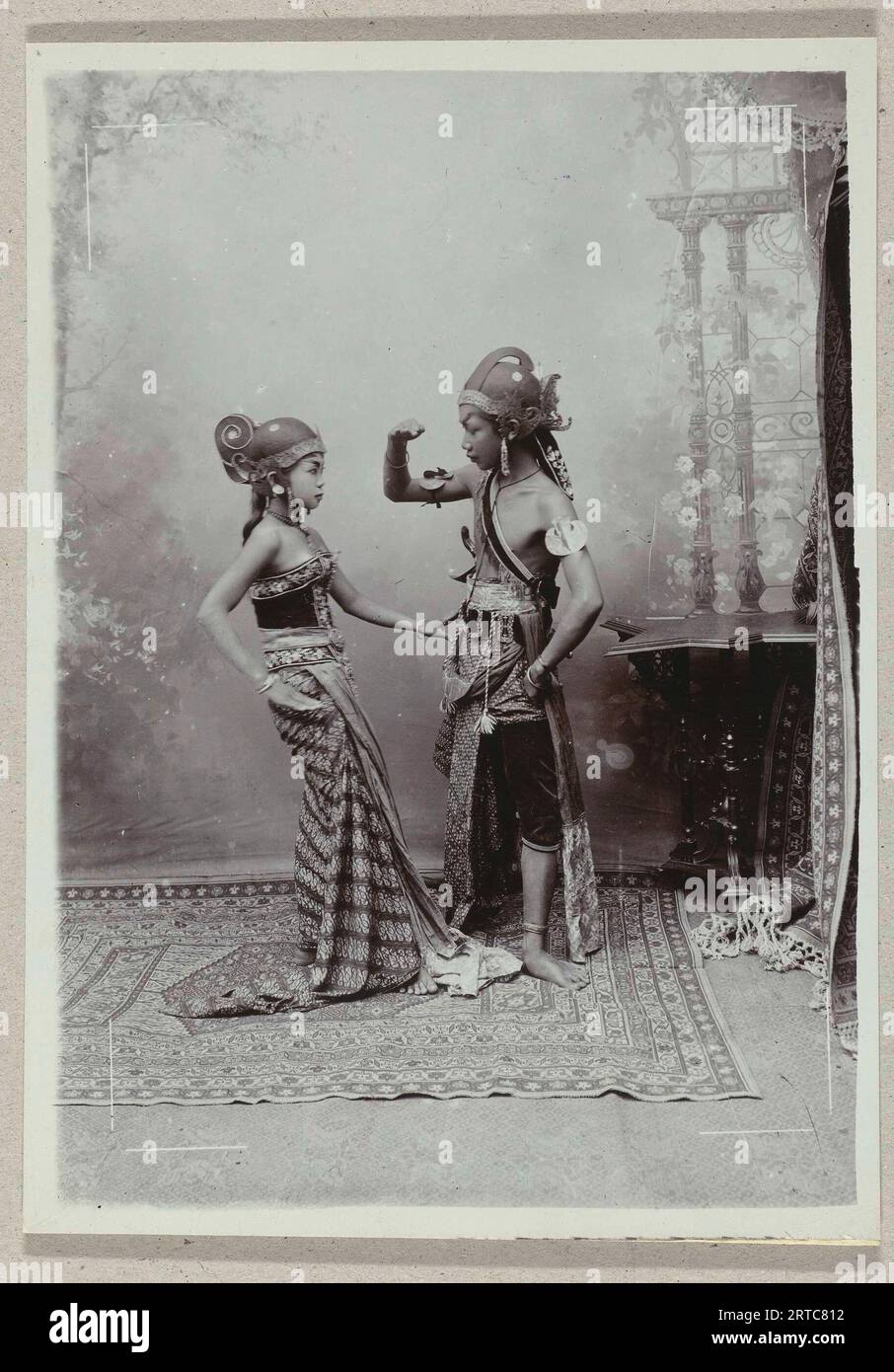 Studio portrait of two Javanese dancers in traditional clothes and make ...