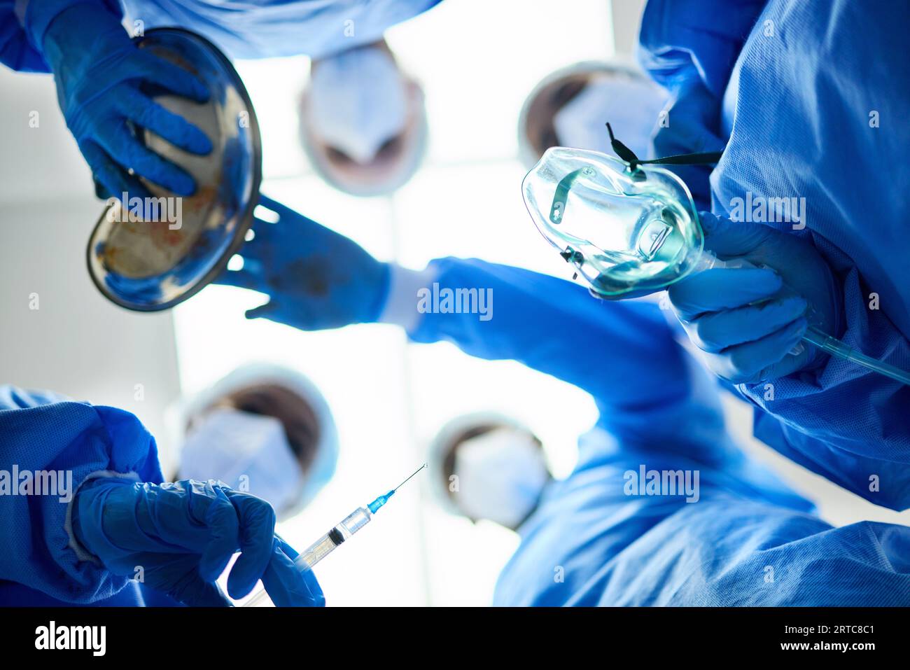 Surgery team, below and a doctors in a hospital or theatre to start ...