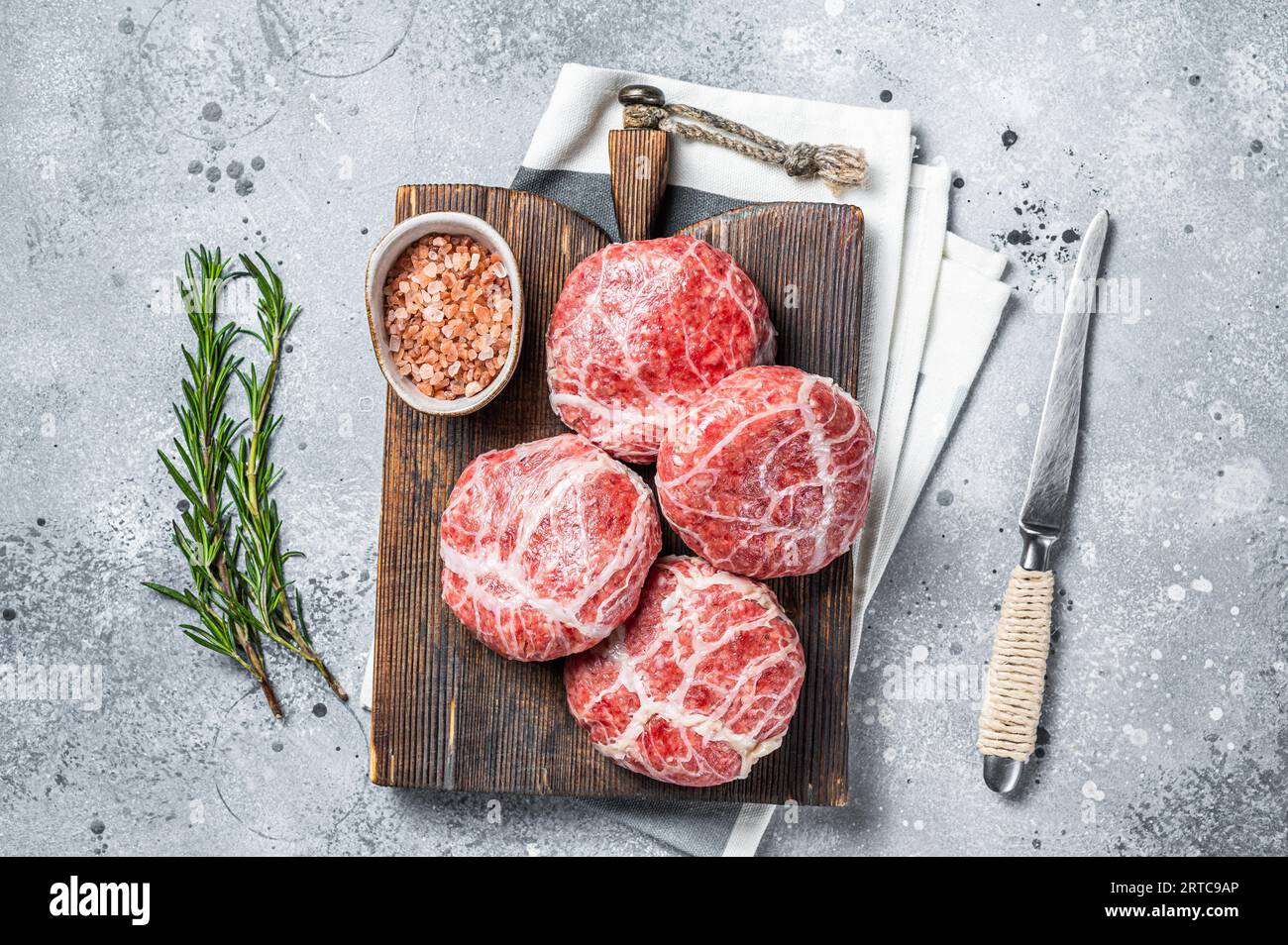 Raw Caul Fat Meatballs burger cutlets, fresh meat. Gray background. Top ...