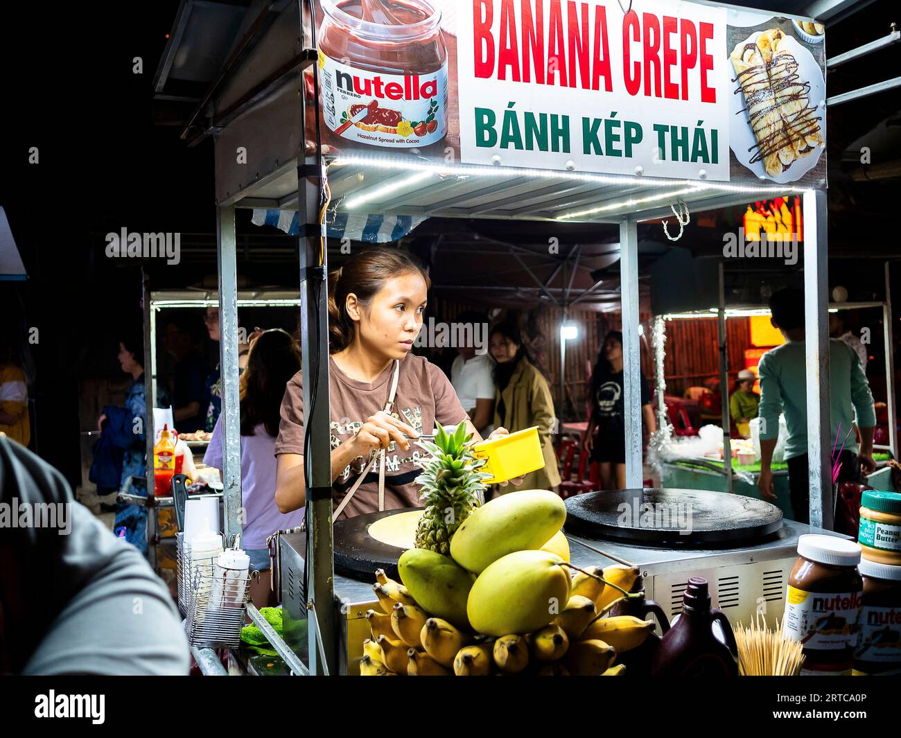 A banana crepe vendor in Hoi An vietnam Stock Photo - Alamy