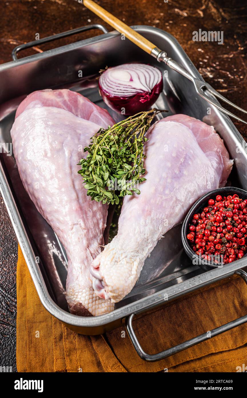 Raw turkey legs Drumsticks, Poultry meat. Dark background. Top view ...