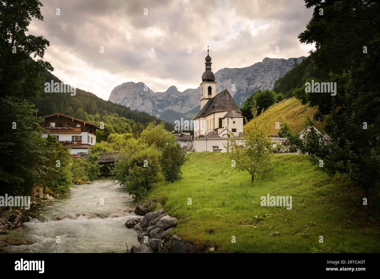 View over the Ramsauer Ache river towards the parish church of St ...