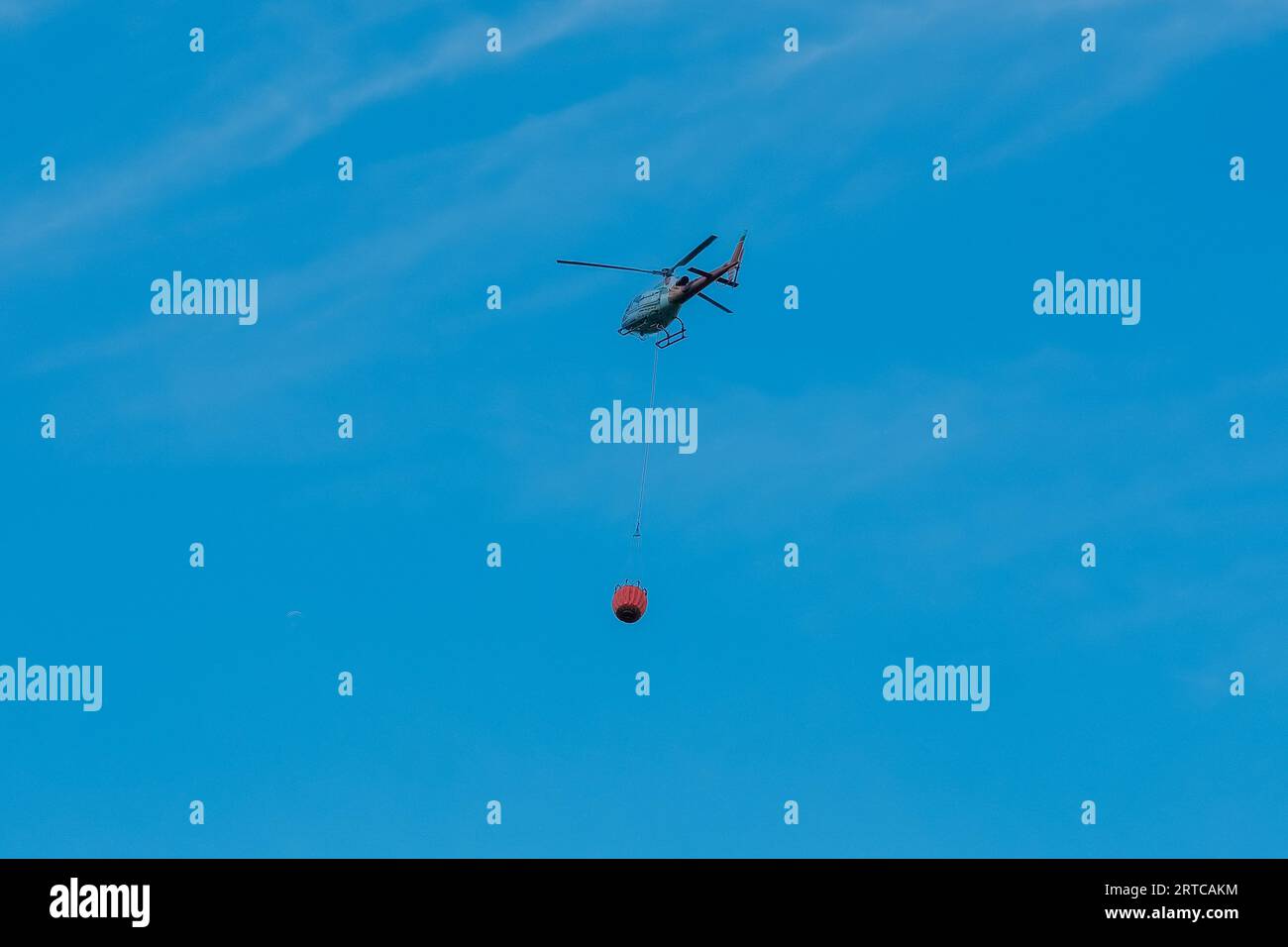 Annecy, france - september 2022: Distant helicopter carrying sack of ...