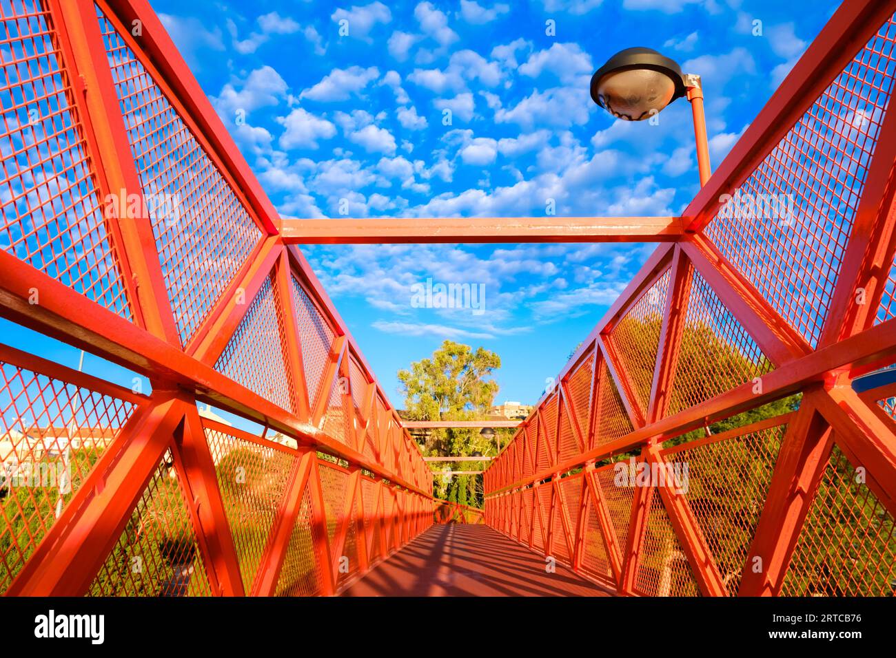 A metallic walkway saves the pedestrian crossing over a highway ...