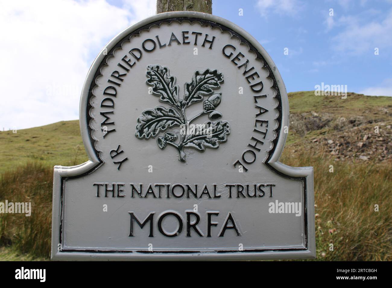 National Trust Sign with oak leaf and National Trust translated into ...