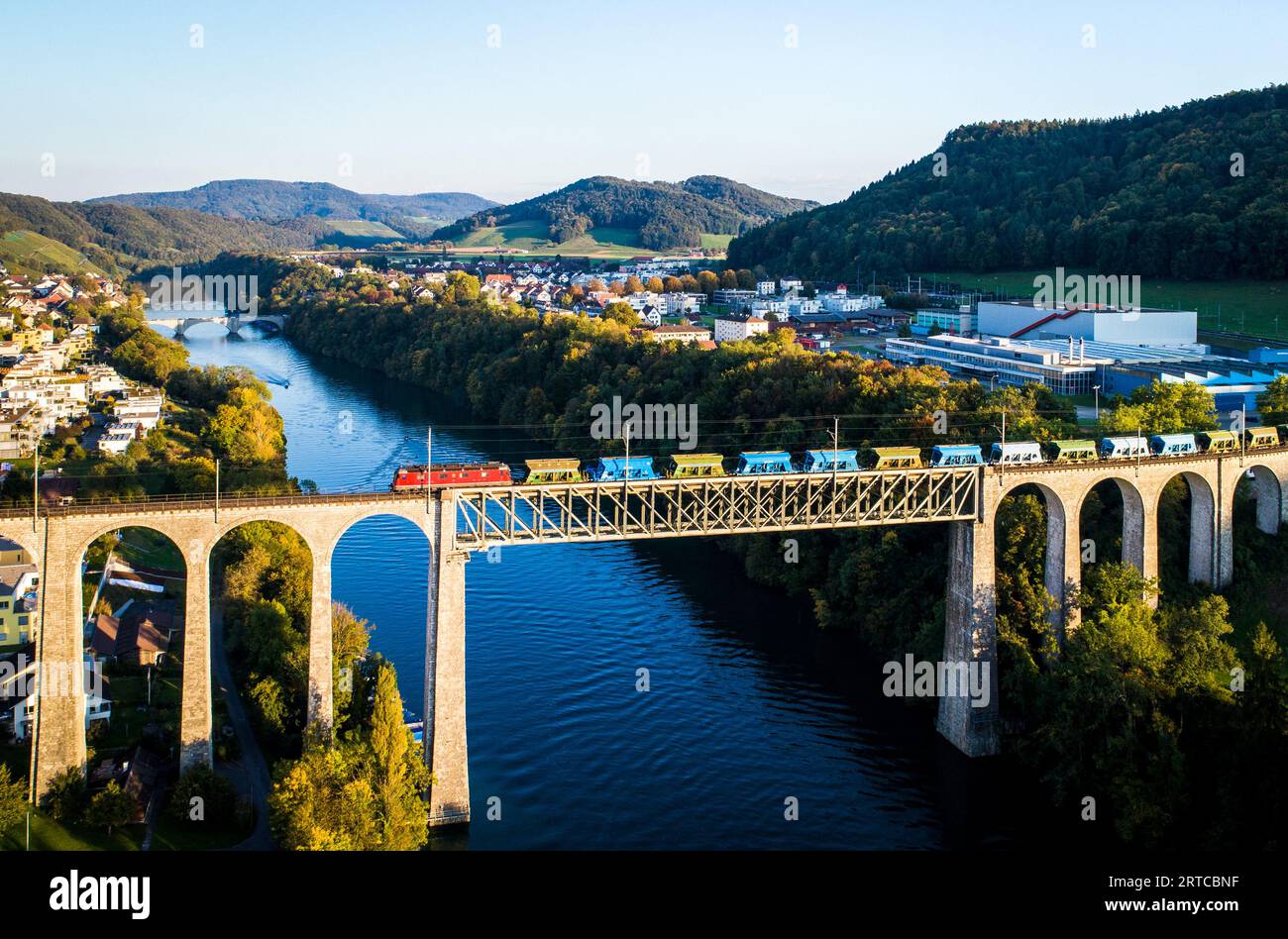 Red, Green & Blue Train, Freight train on bridge over River Rhein ...