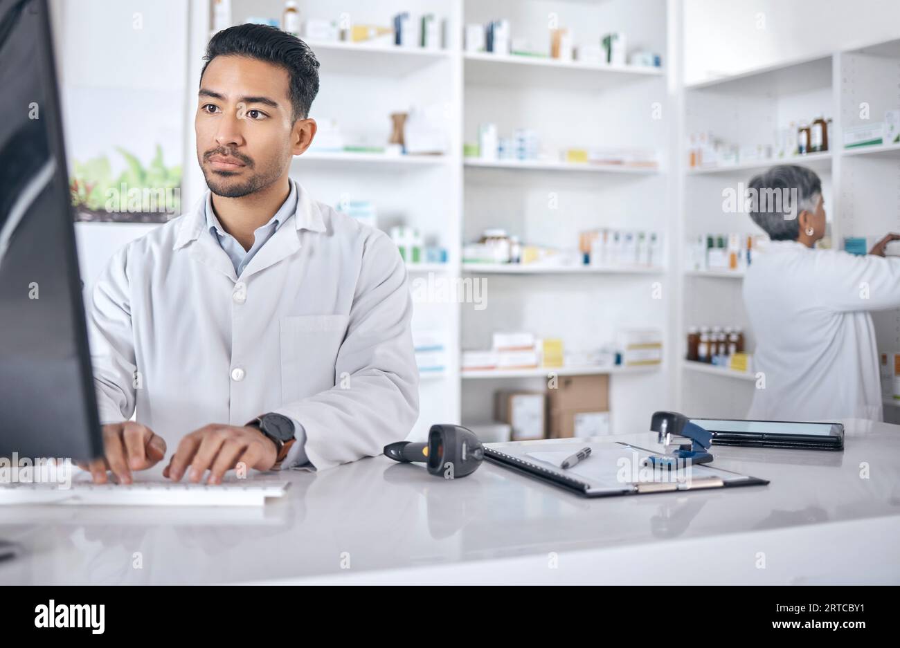 Pharmacist, computer and man typing, inventory and connection with ...