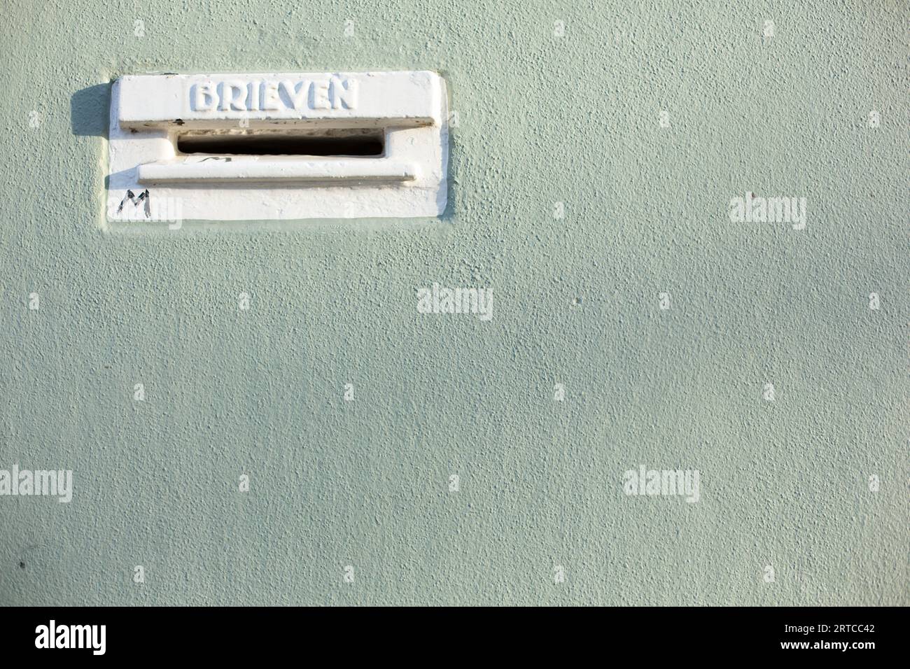 Amsterdam, The Netherlands, Postbox in Dutch on a green wall Stock ...