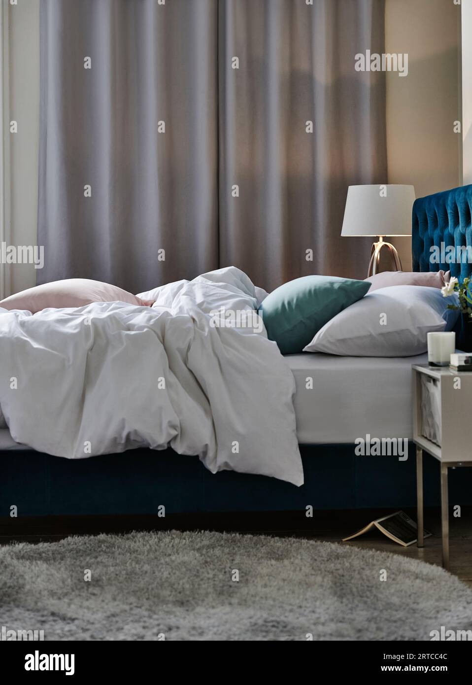 Beautiful young model preparing for bed, sleeping in bed bedroom scene ...