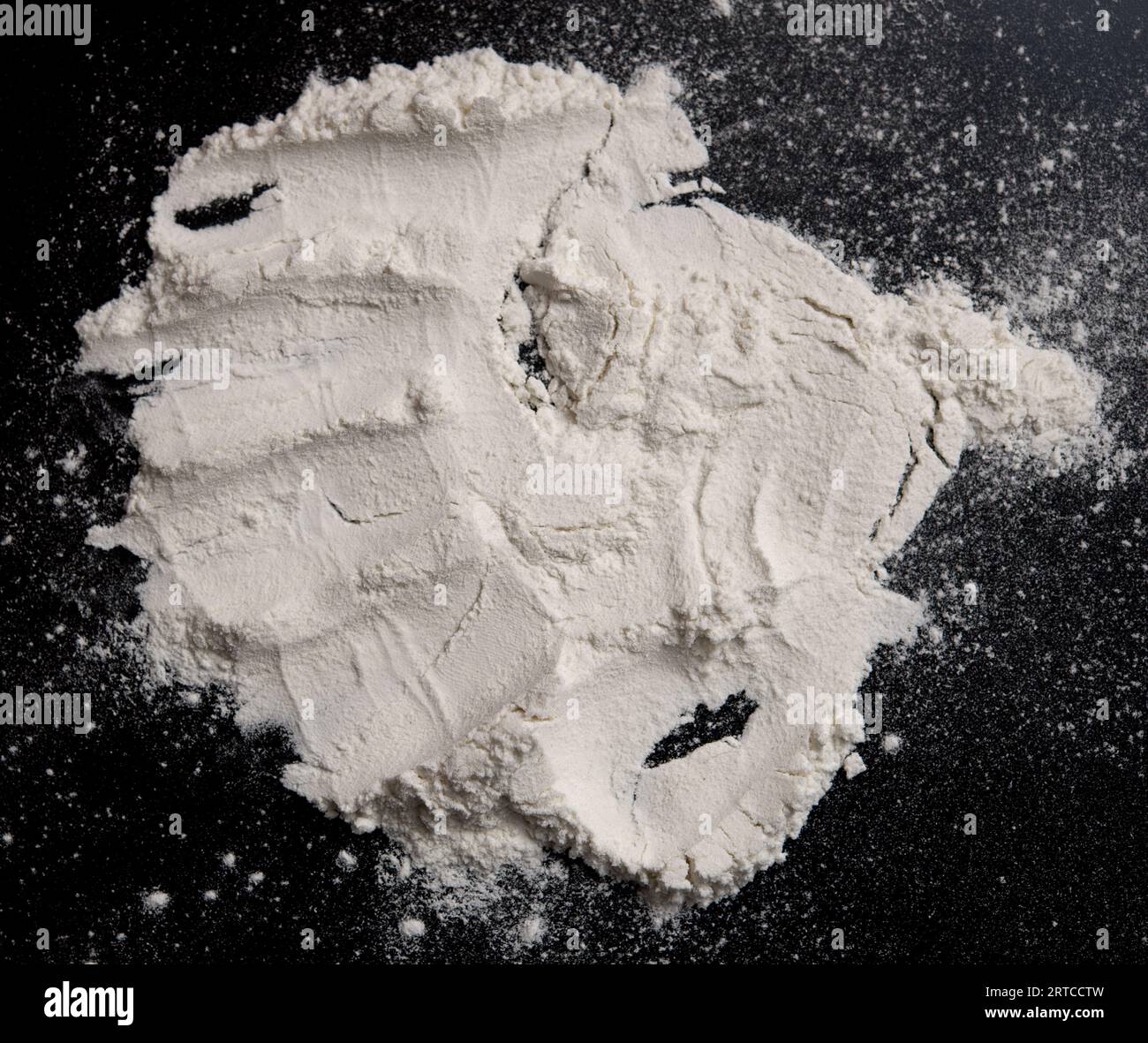 Wheat flour on black background Stock Photo - Alamy