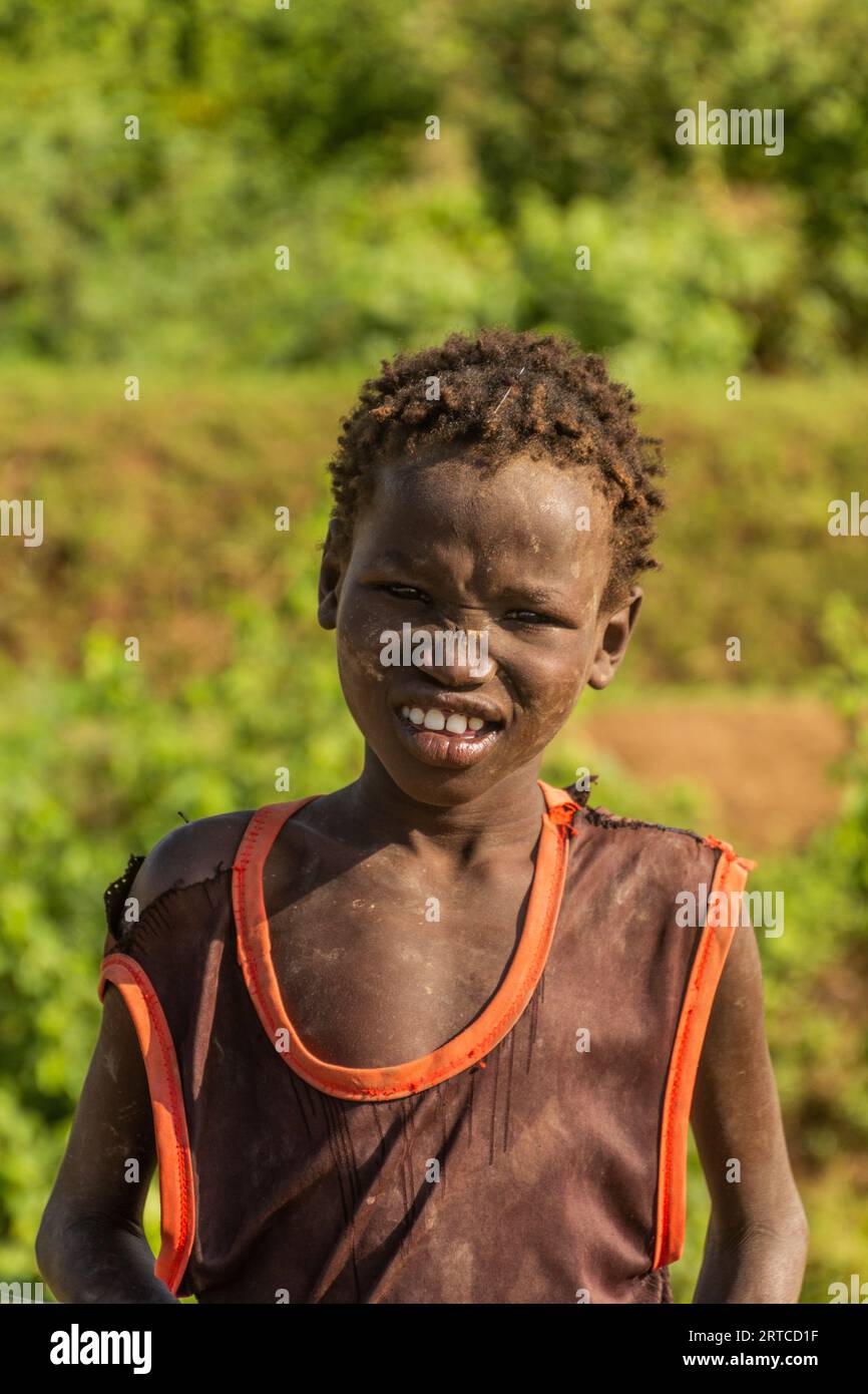 OMO VALLEY, ETHIOPIA - FEBRUARY 5, 2020: Tribal child in Omo valley ... OMO VALLEY, ETHIOPIA - FEBRUARY 5, 2020: Tribal child in Omo valley ...