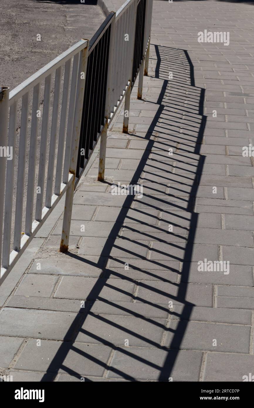 Handrail by road. Pedestrian barrier. Fence along road. Fencing details ...
