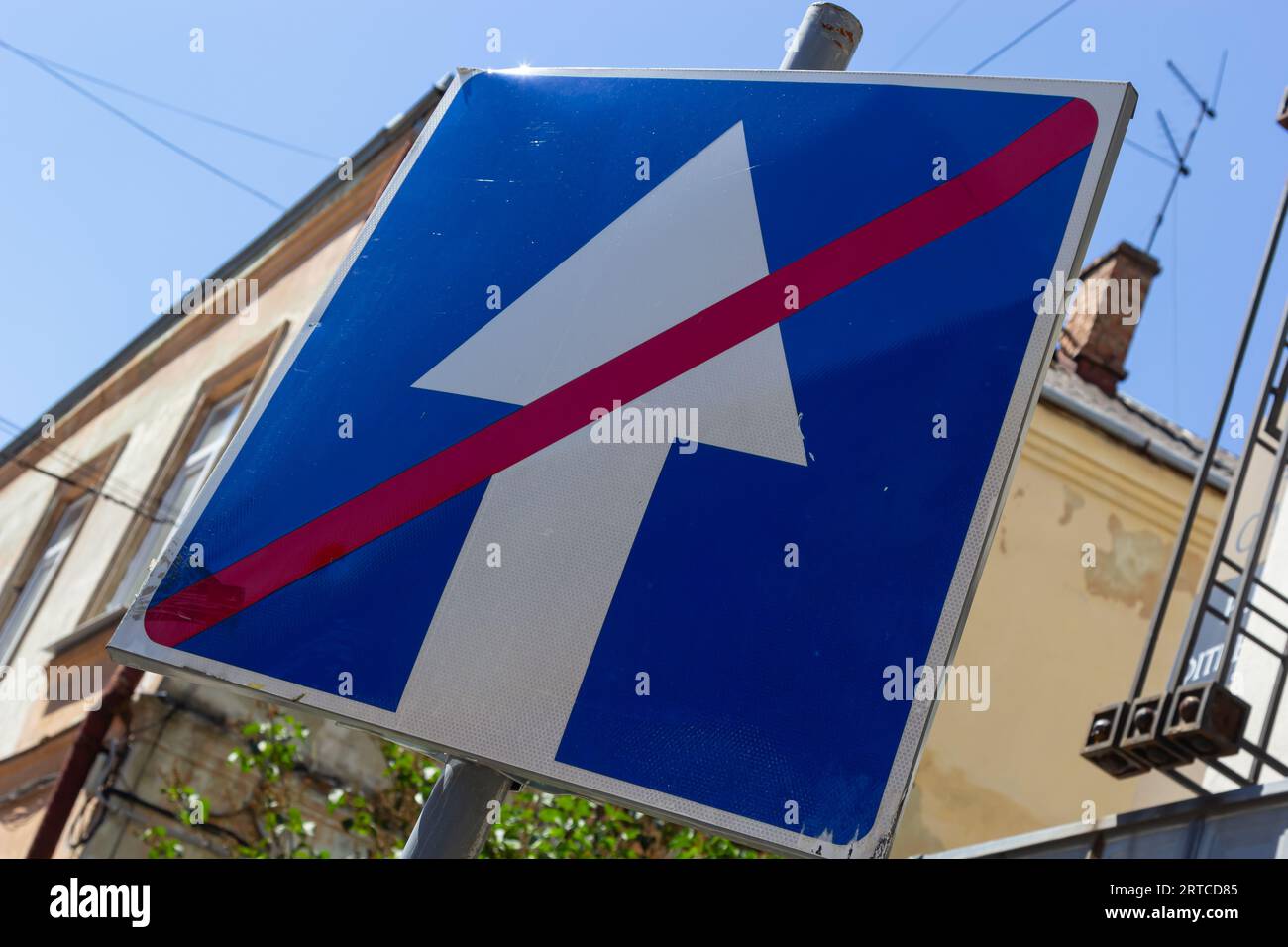 One way street road sign, White arrow in blue background, crossed out ...