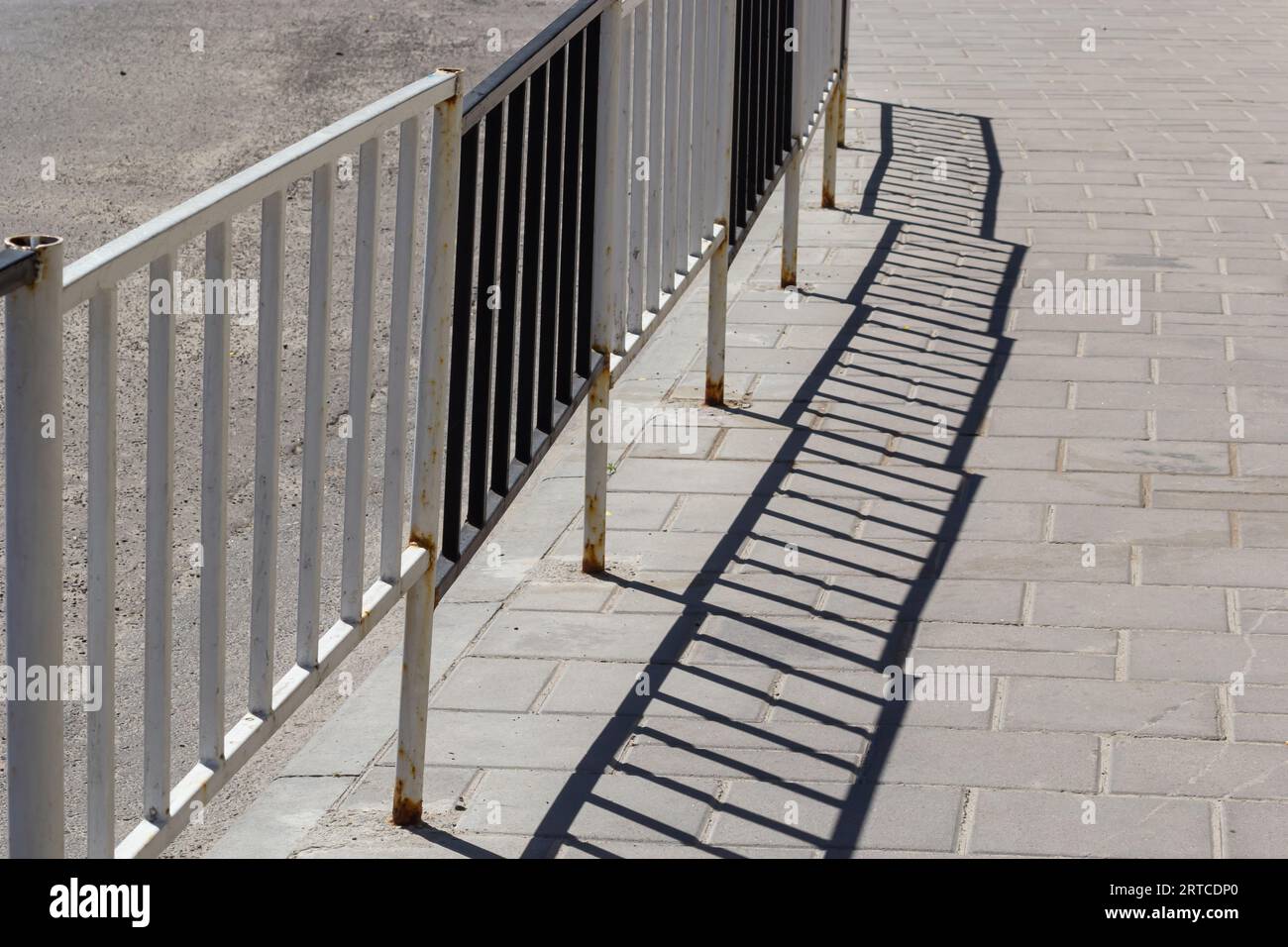 Handrail by road. Pedestrian barrier. Fence along road. Fencing details ...