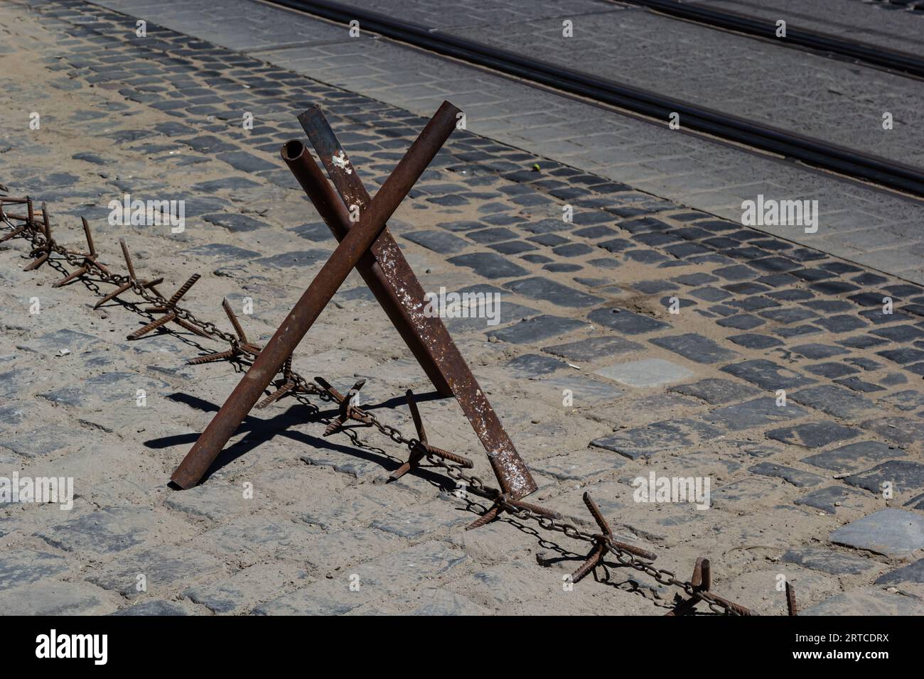 Iron hedgehog. Anti-tank barrier. Military industry. Block on the road ...