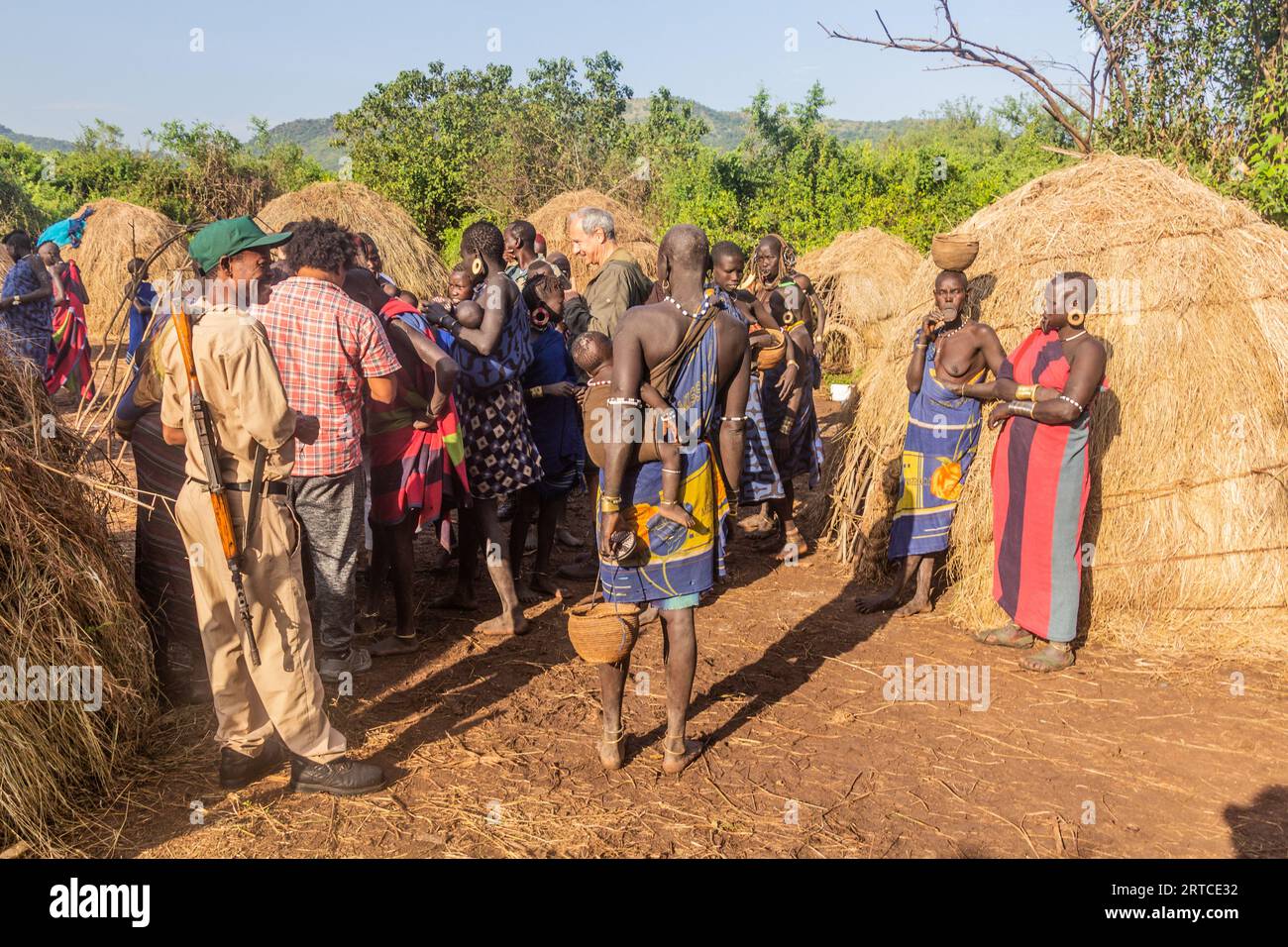 OMO VALLEY, ETHIOPIA - FEBRUARY 6, 2020: Tourists visiting Mursi tribe ...