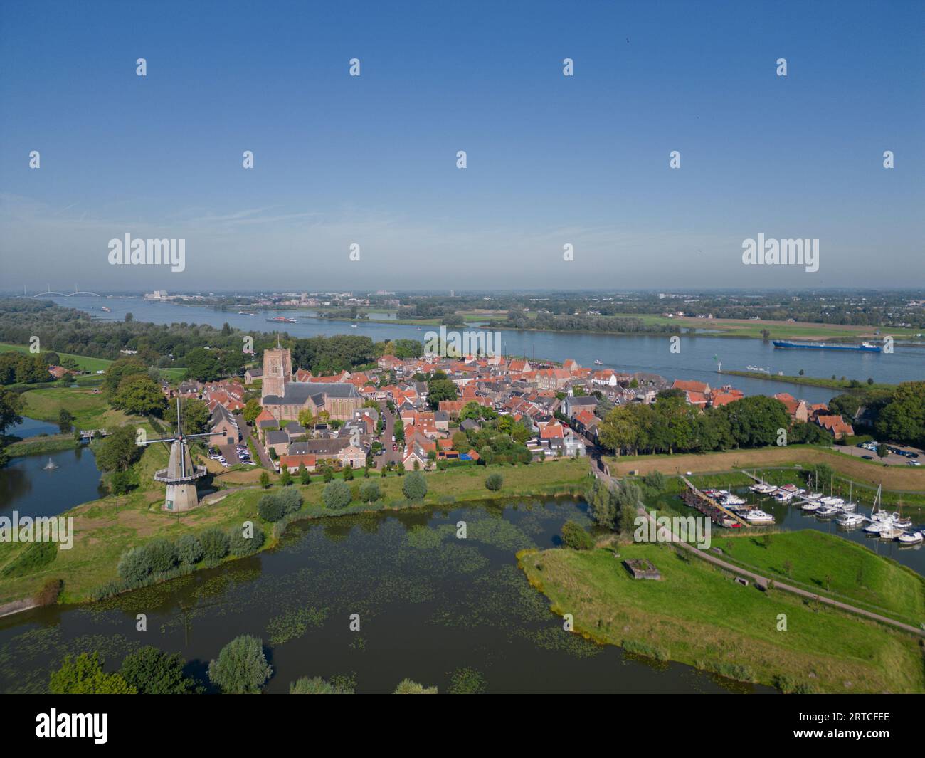 Aerial from the historical city Woudrichem at the river Merwede in the ...