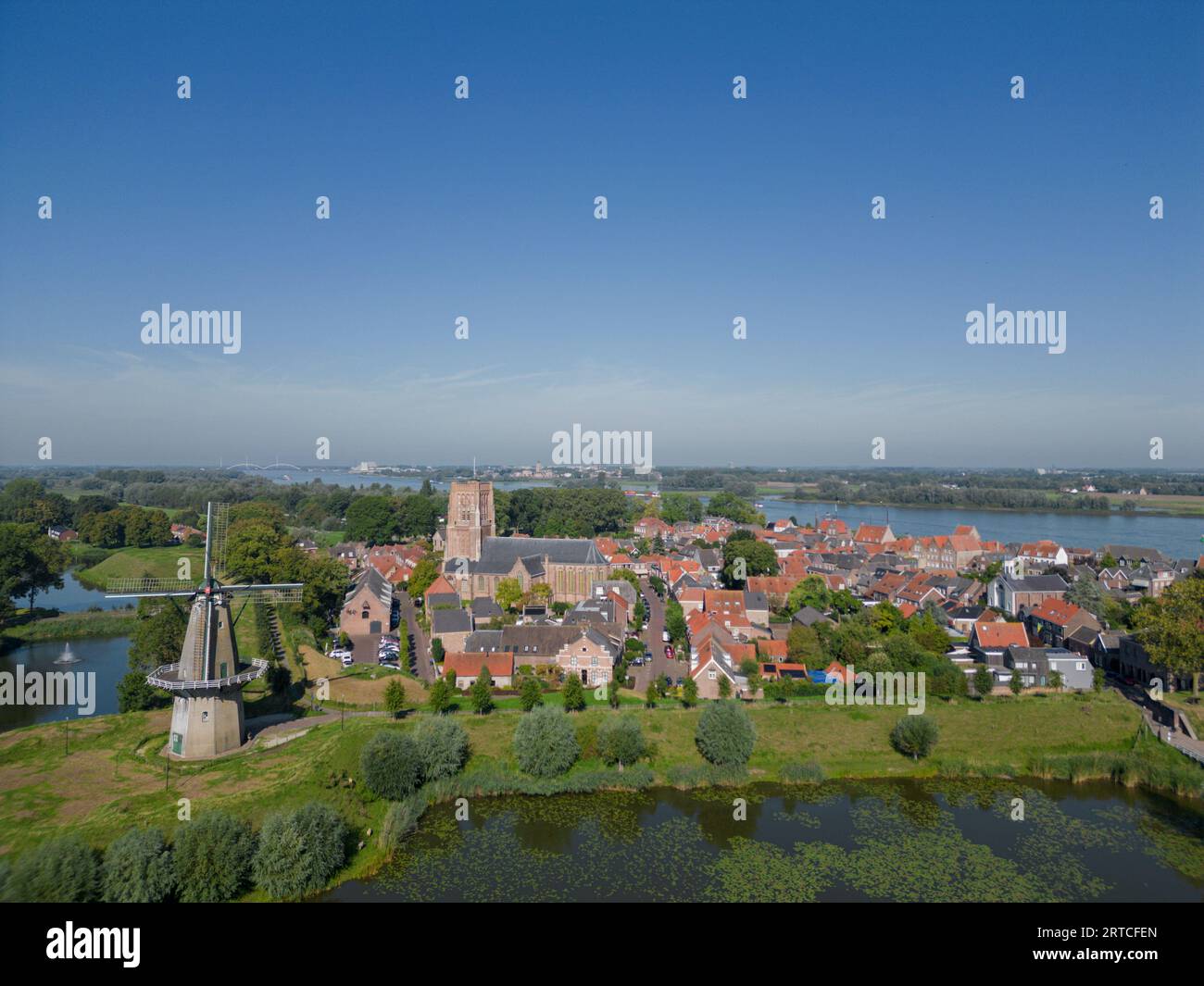 Aerial from the historical city Woudrichem at the river Merwede in the ...