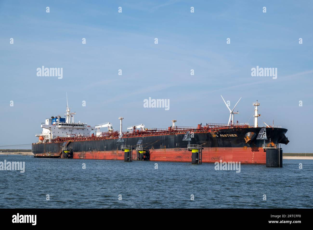 Large LNG tanker ship in a harbour on a clear summer day. Port of ...