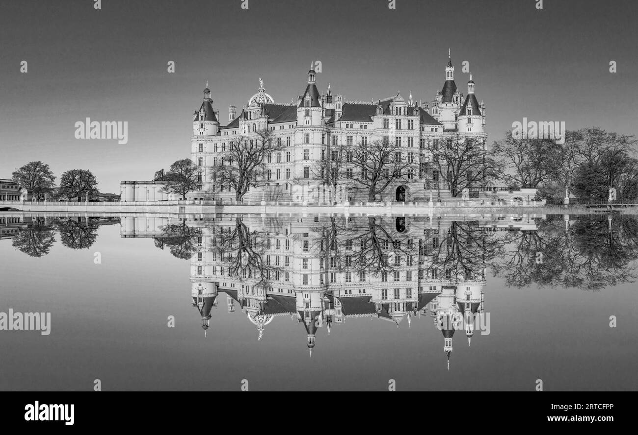 famous schwerin castle in bright light mirroring in the lake, Schwerin ...