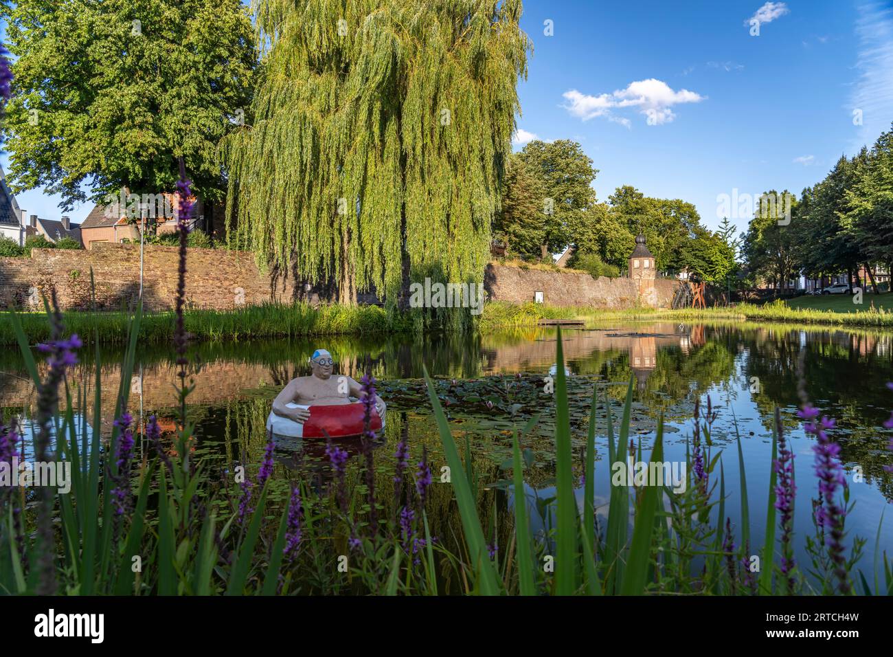 Frog pond with sculpture Paul, the swimming tire man and the city wall ...