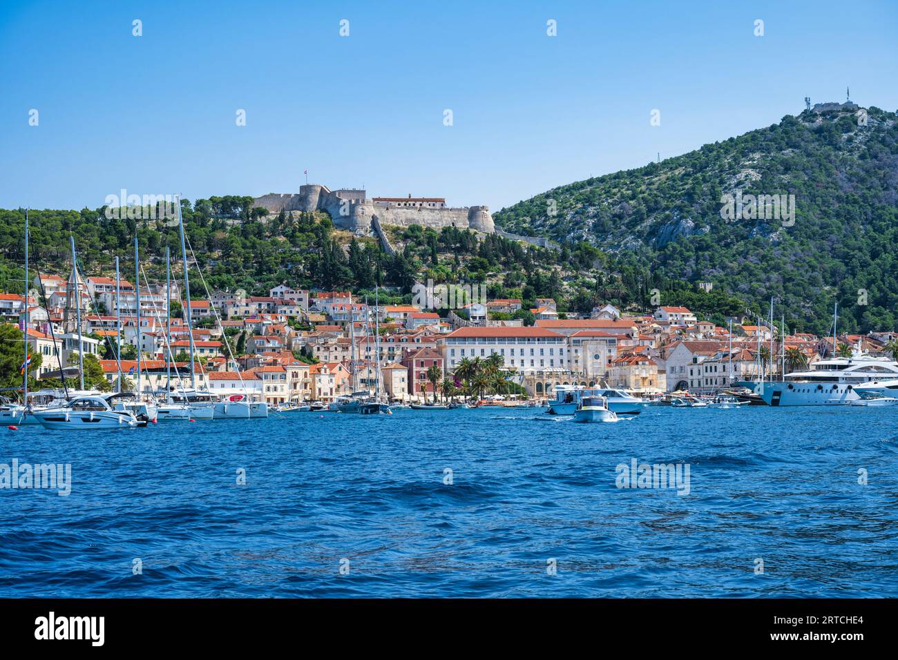 Approach to Hvar harbour with Fortica (Spanish Fortress) on hillside ...