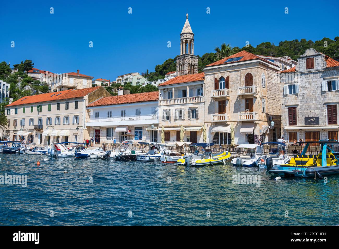 Waterfront of Hvar with bell tower of St Mark’s Church in background ...