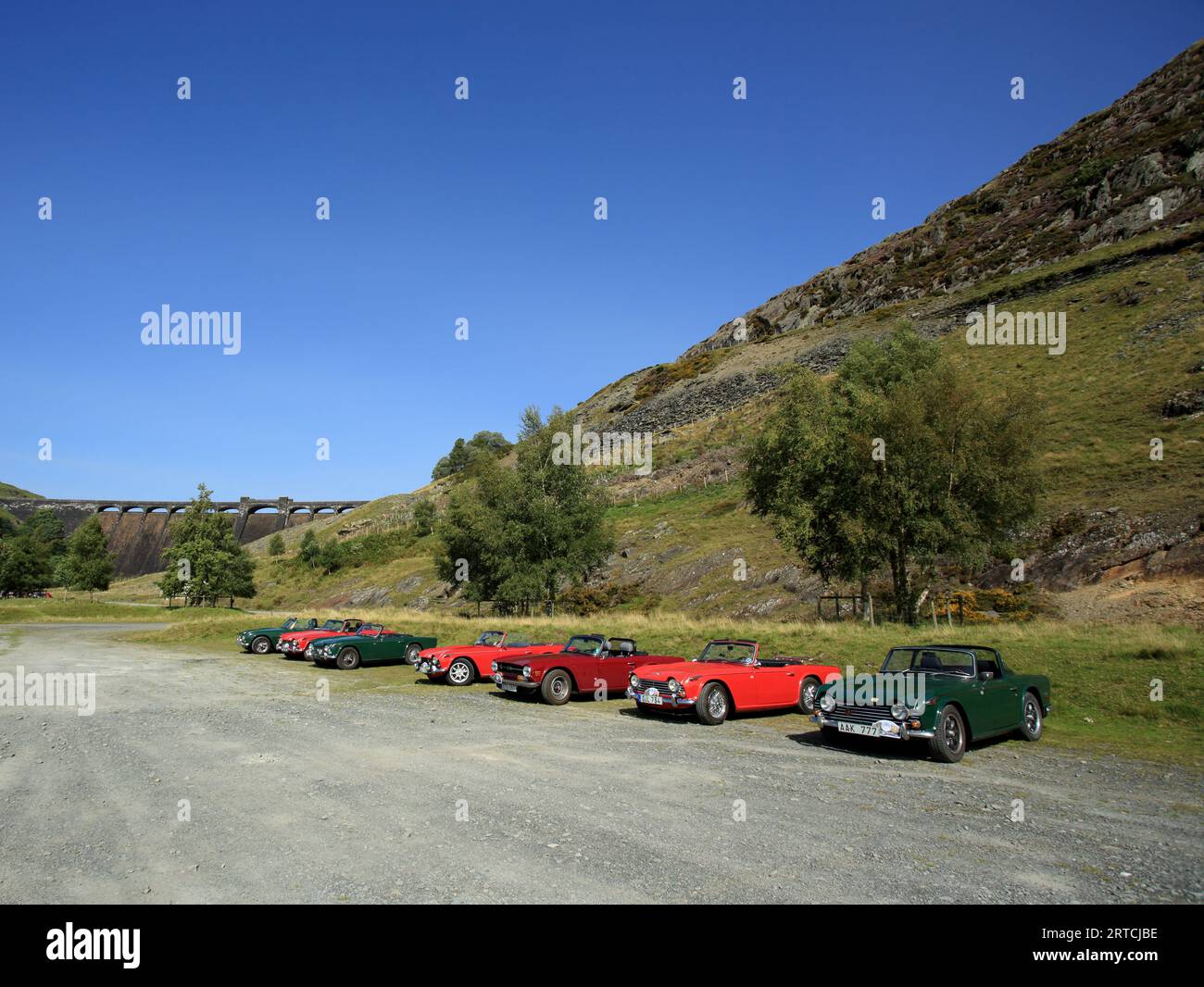 Classic Triumph TR sports cars parked in the Elan valley, Powys, Wales ...