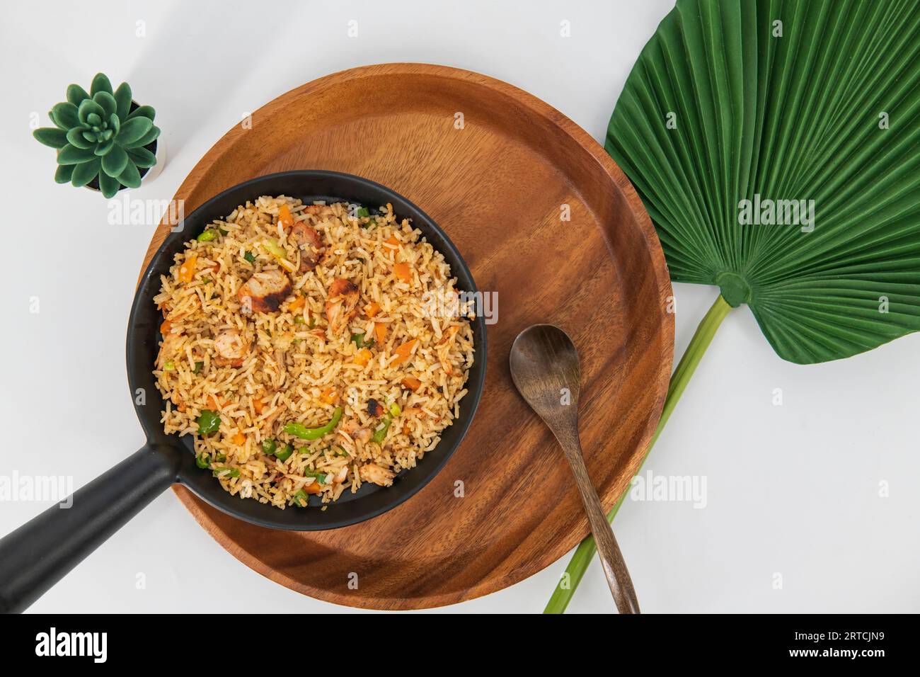Chicken Fried Rice in black serve bowl isolated on white background ...