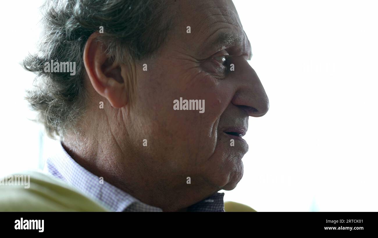 Anxious senior man close-up face biting lips feeling distressed while ...