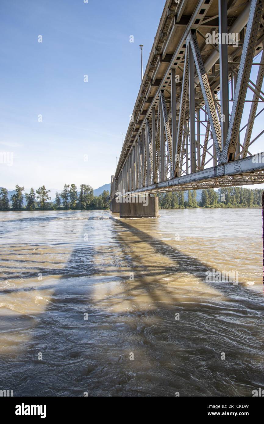 A vertical shot of the Agassiz Bridge over the Fraser River Stock Photo ...