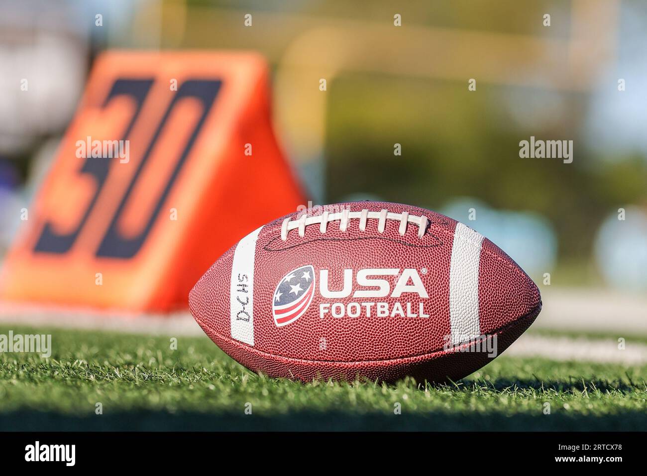 USA Football resting on football field, near 30 yard marker Stock Photo ...