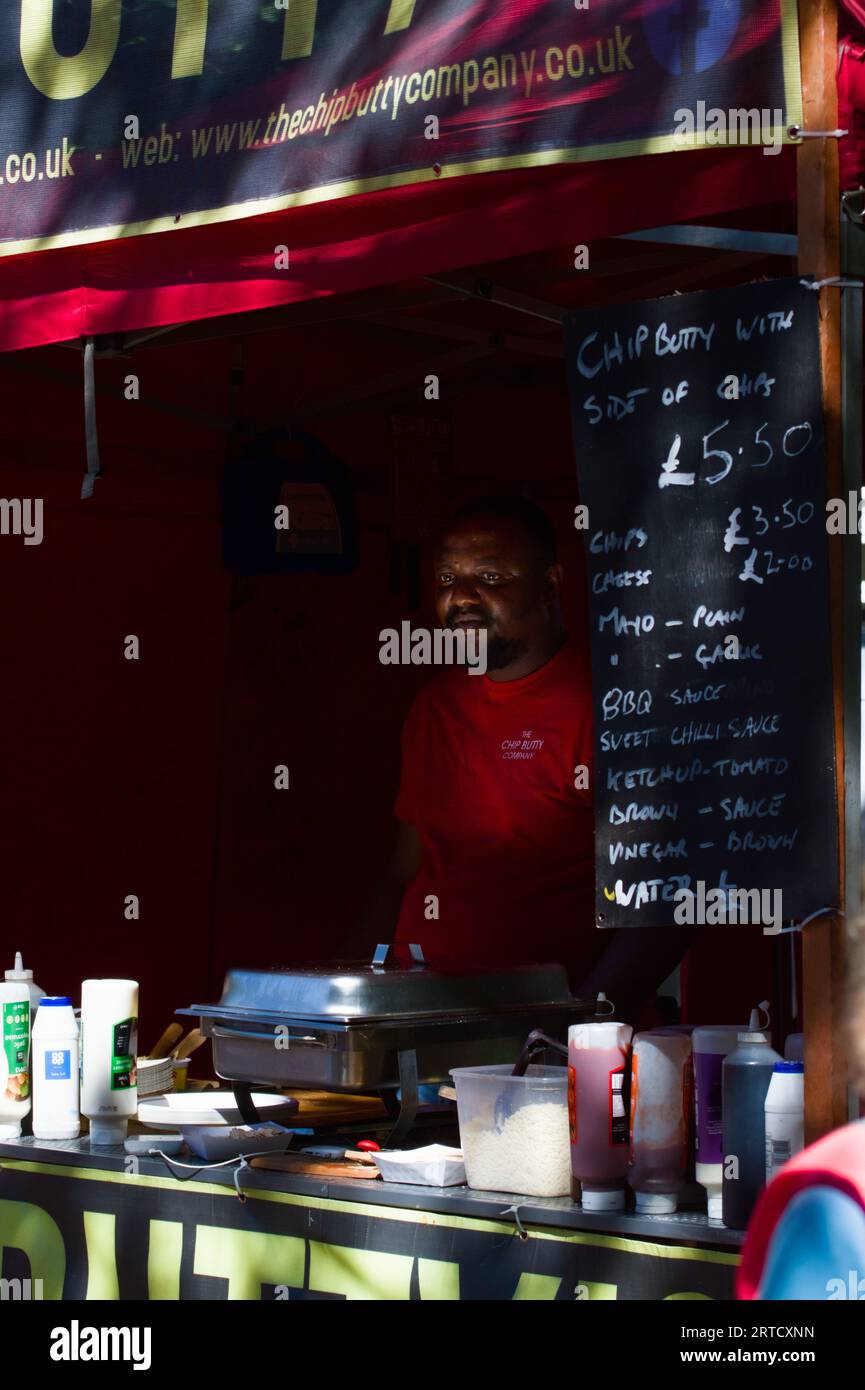 Market Stall Holder Street Vendor Selling Food At A Village Festival ...