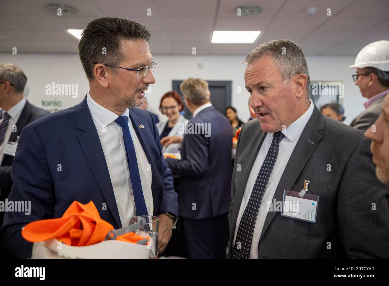Northern Ireland minister Steve Baker (left) speaking with Sinn Fein ...