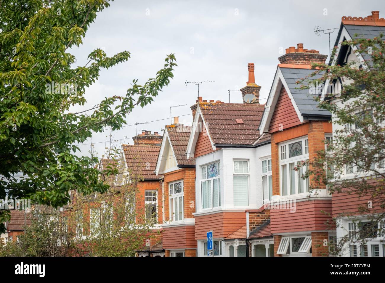 Street of typical British residential family terrace houses in south ...
