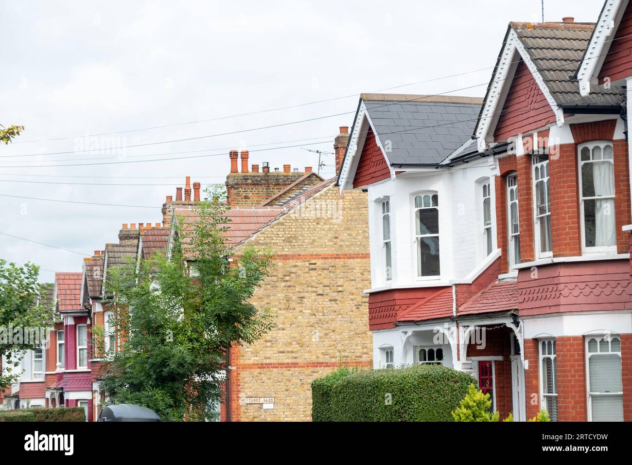 Street of typical British residential family terrace houses in south ...